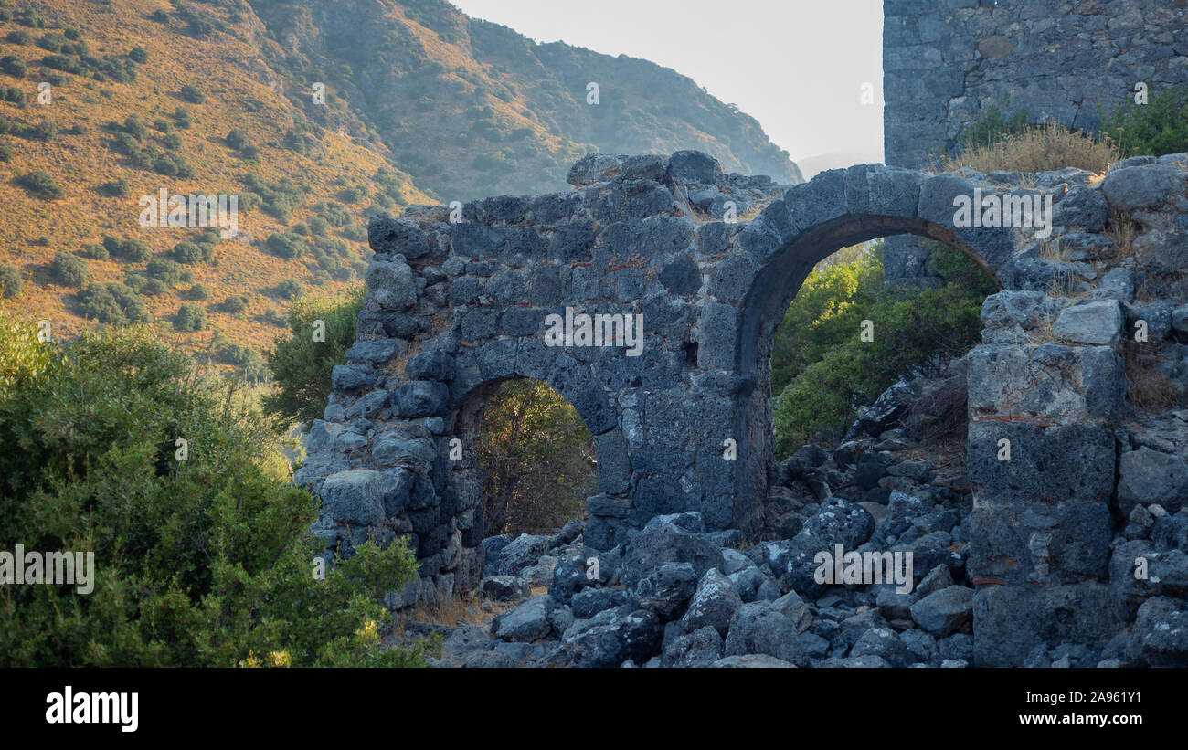 Ruins of the ancient city, ancient architecture. Walls and arches of an ...