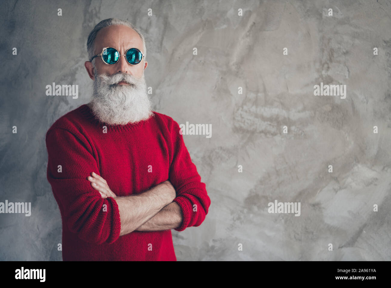 Portrait of serious brutal old man cross hands look gorgeous on x-mas ...