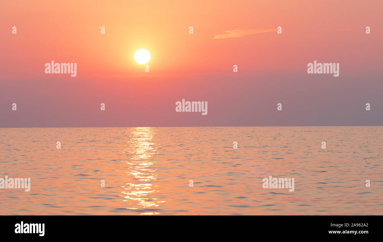 Pink sunset in the sea, gentle romantic natural background. Unity with ...