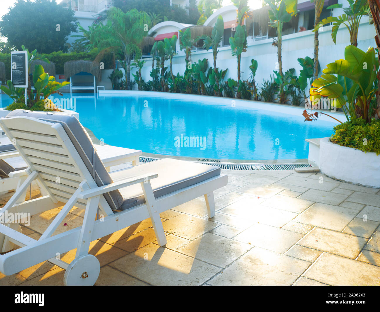 Sun loungers by the pool, a comfortable luxury holiday in the resort ...