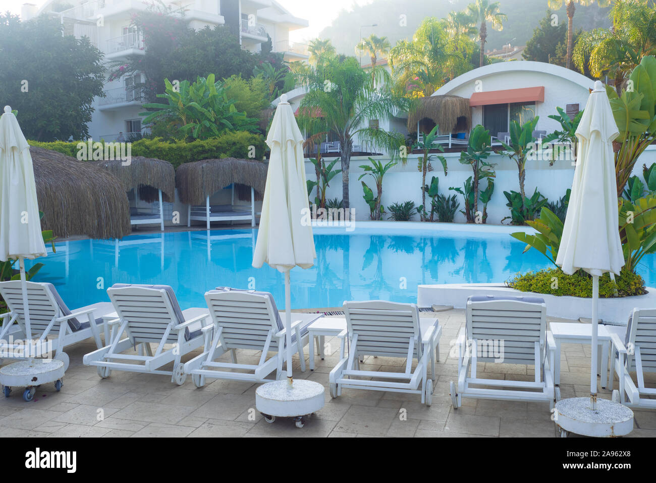 Sun loungers by the pool, a comfortable luxury holiday in the resort ...
