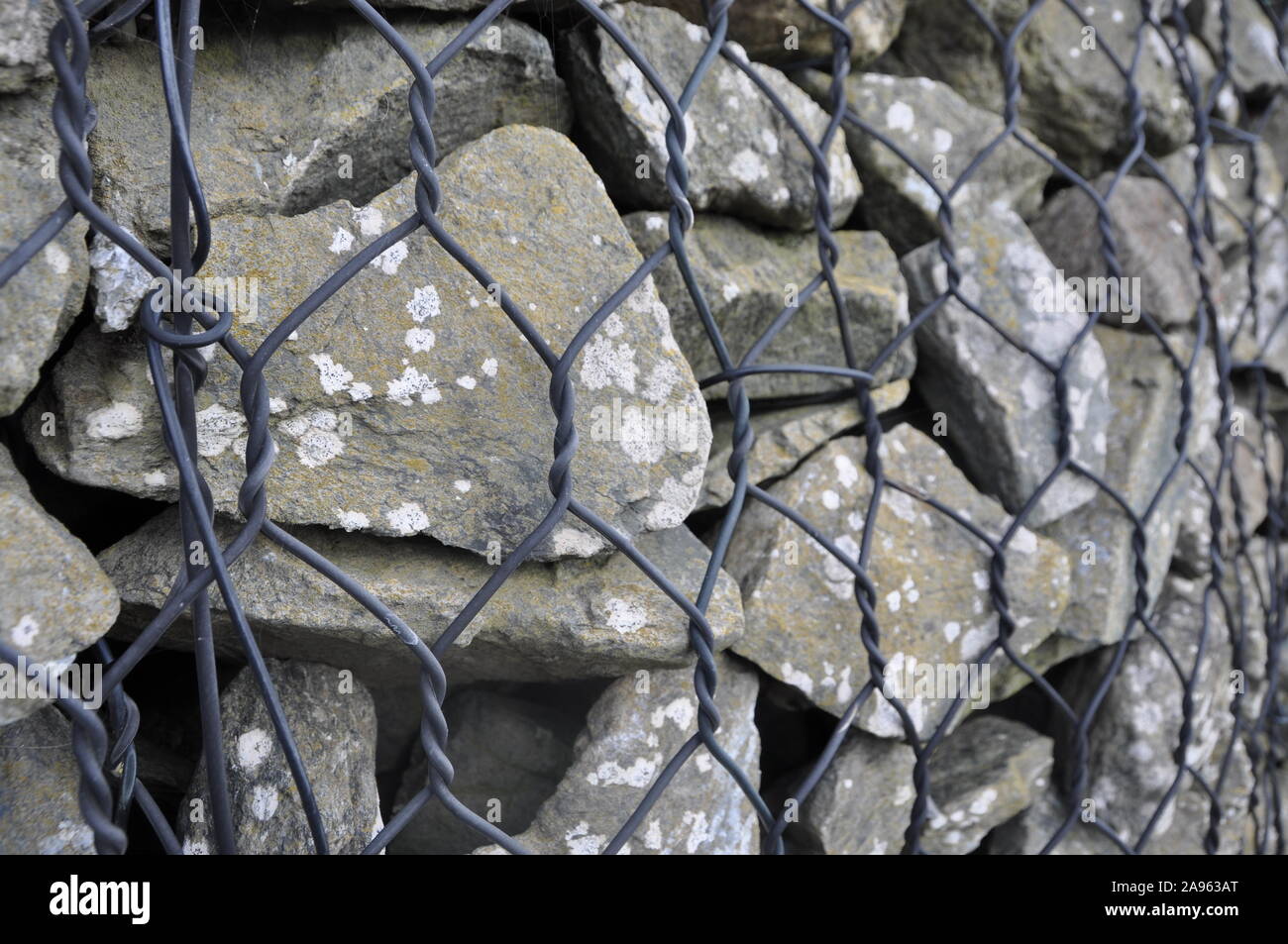 stone wall cage background Stock Photo - Alamy