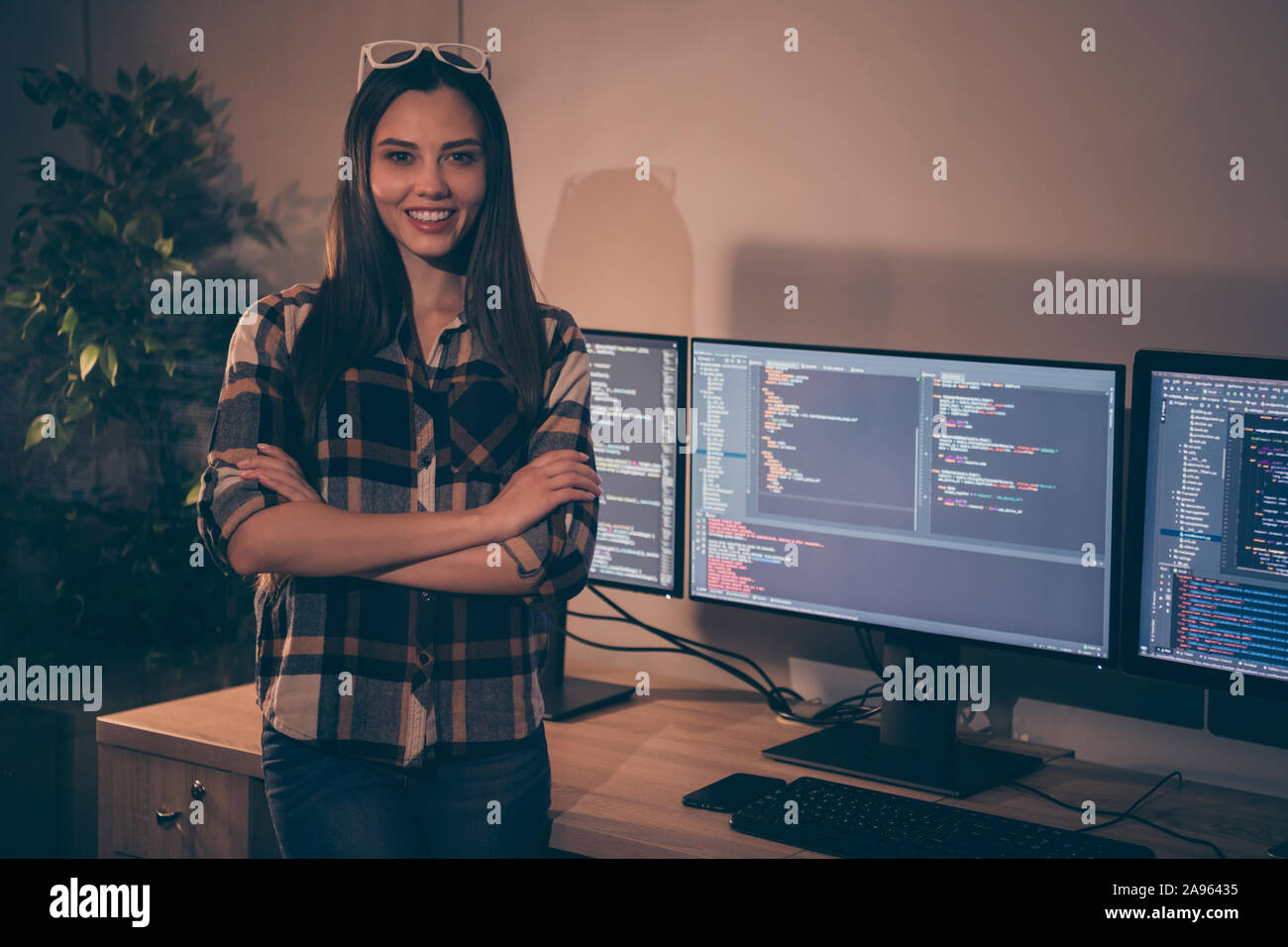 Photo of cheerful positive developer with hands folded standing ...