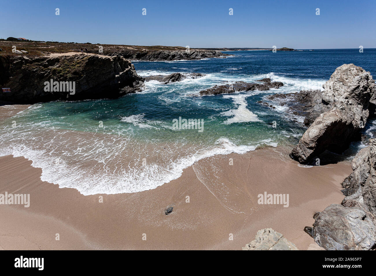 Small beach of crystal clear water protected from the waves of the ...