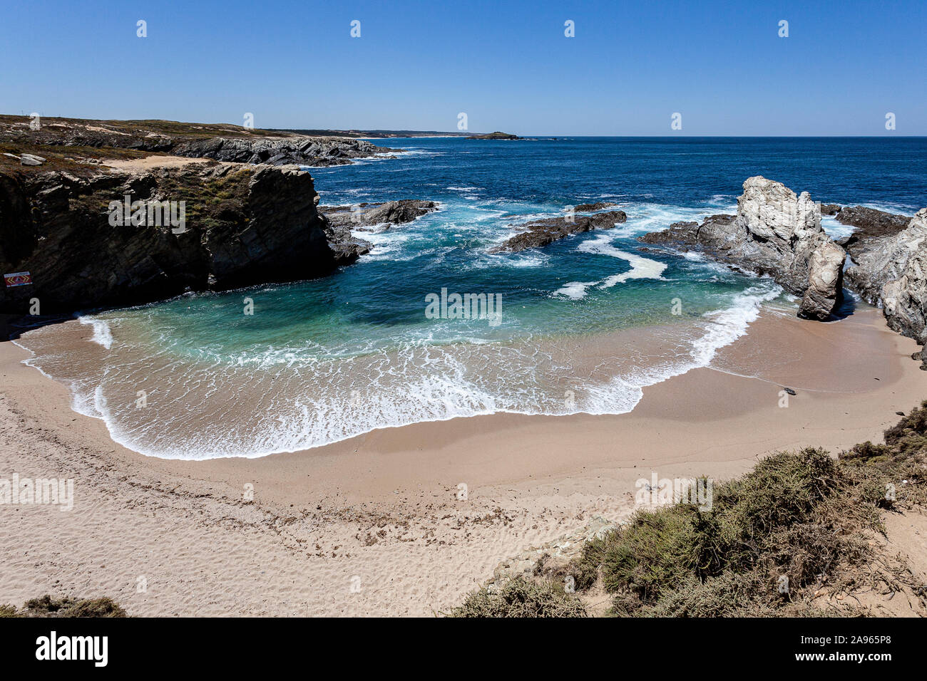 Small beach of crystal clear water protected from the waves of the ...