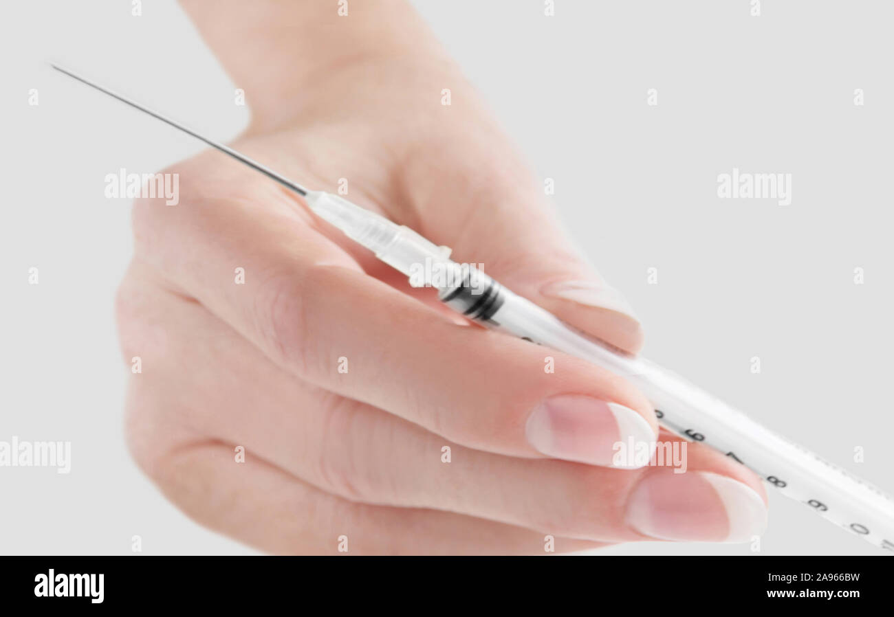 Injection and female hand Stock Photo - Alamy