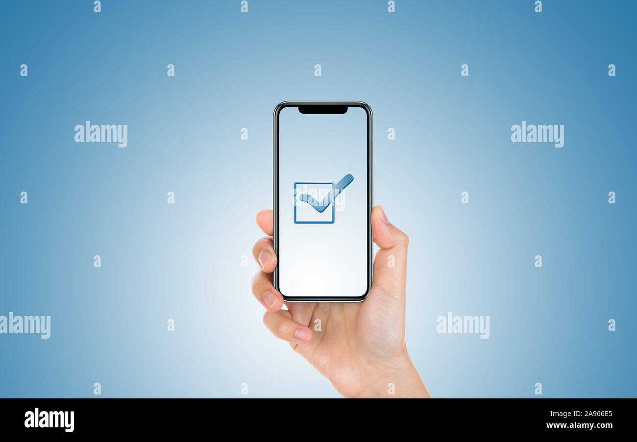 Male hand is holding and showing us a modern smart phone screen with Ok ...