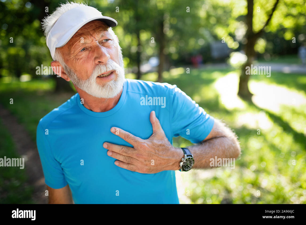 Older man heart attack after running workout outdoor Stock Photo - Alamy