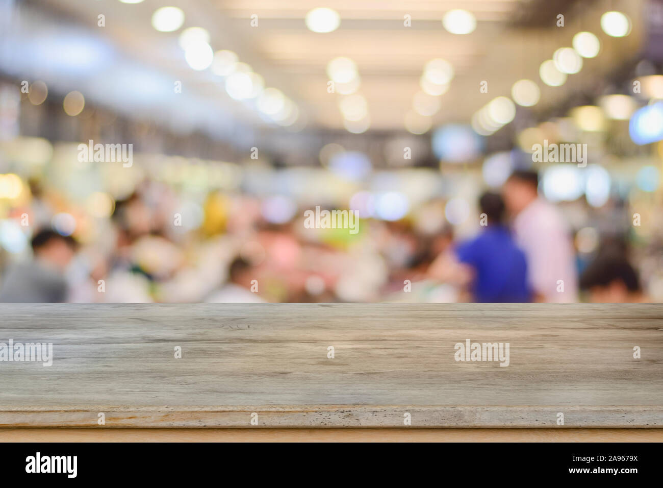 Wooden table top with view on Defocused customer at restaurant blurred ...