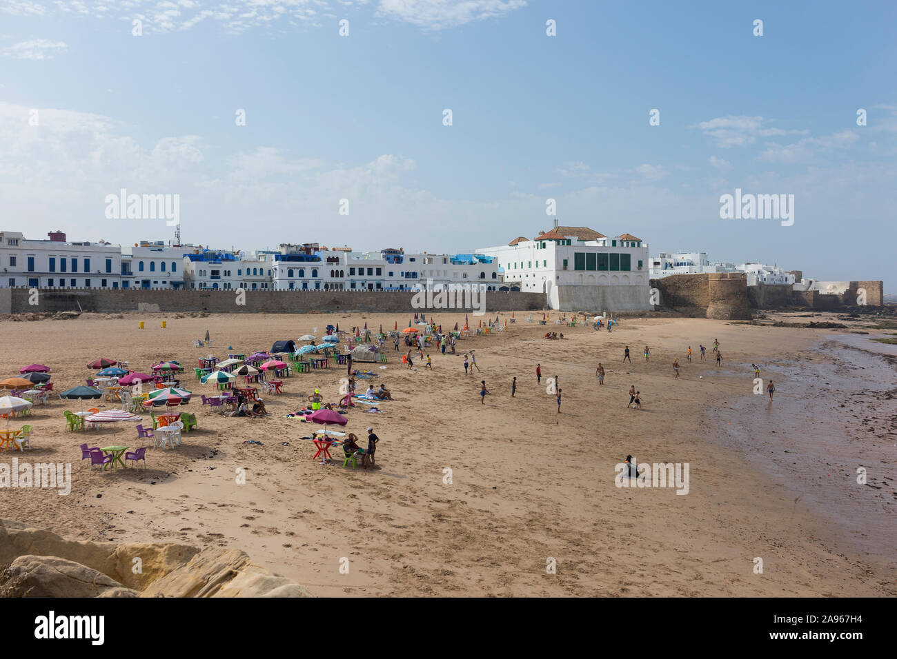 Asilah, Morocco-September 10, 2019: People on a beach in front of the ...
