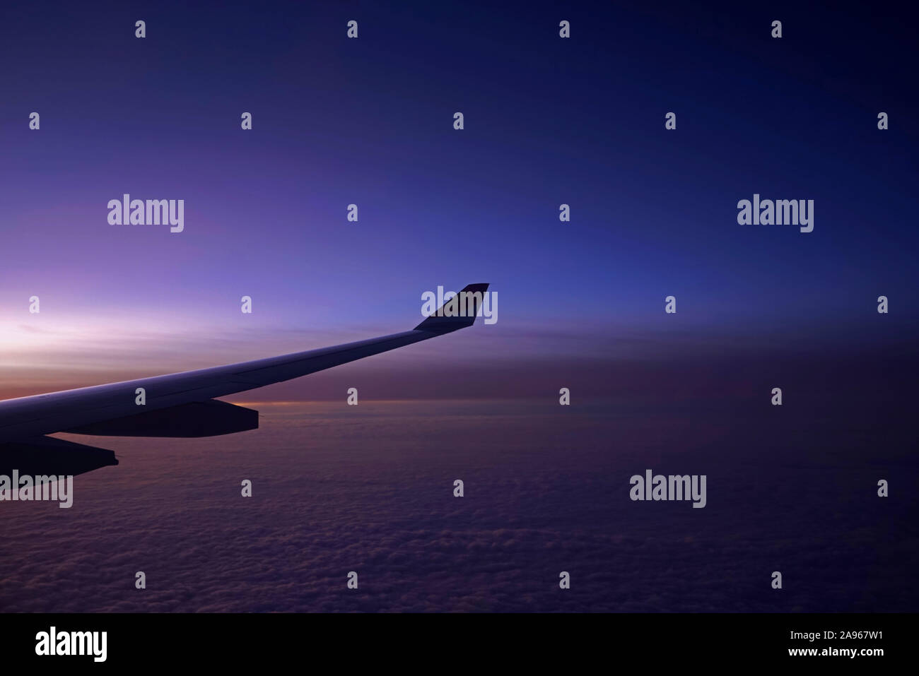 The plane, aeroplane wing, clouds, gradient sky from aerial view Stock ...