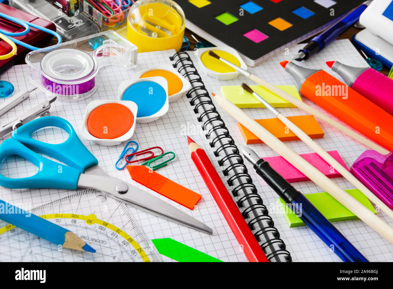 Desk and colorful stationery Stock Photo - Alamy