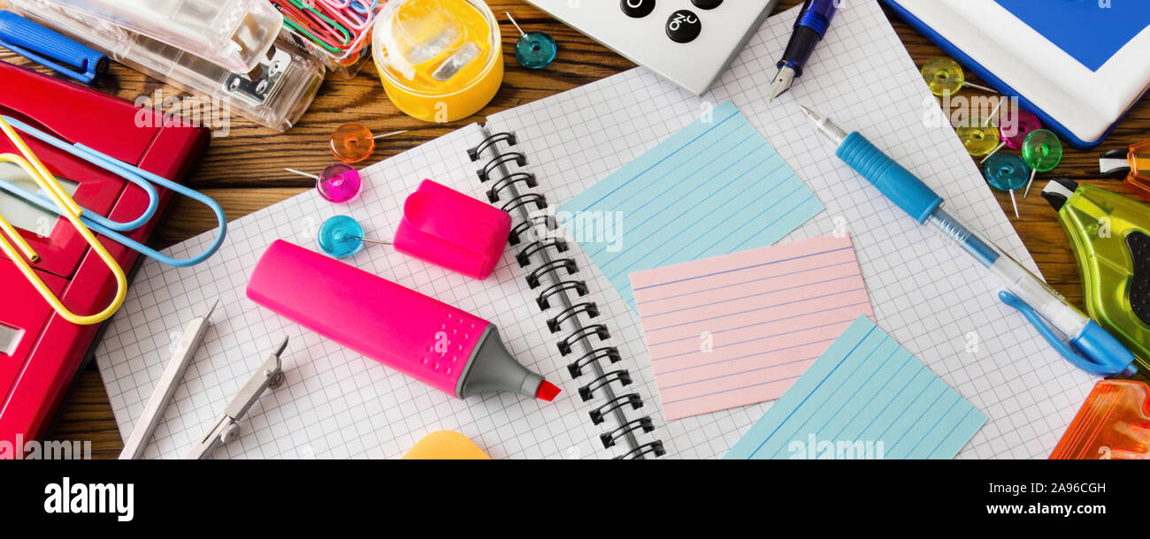 Desk and colorful stationery Stock Photo - Alamy