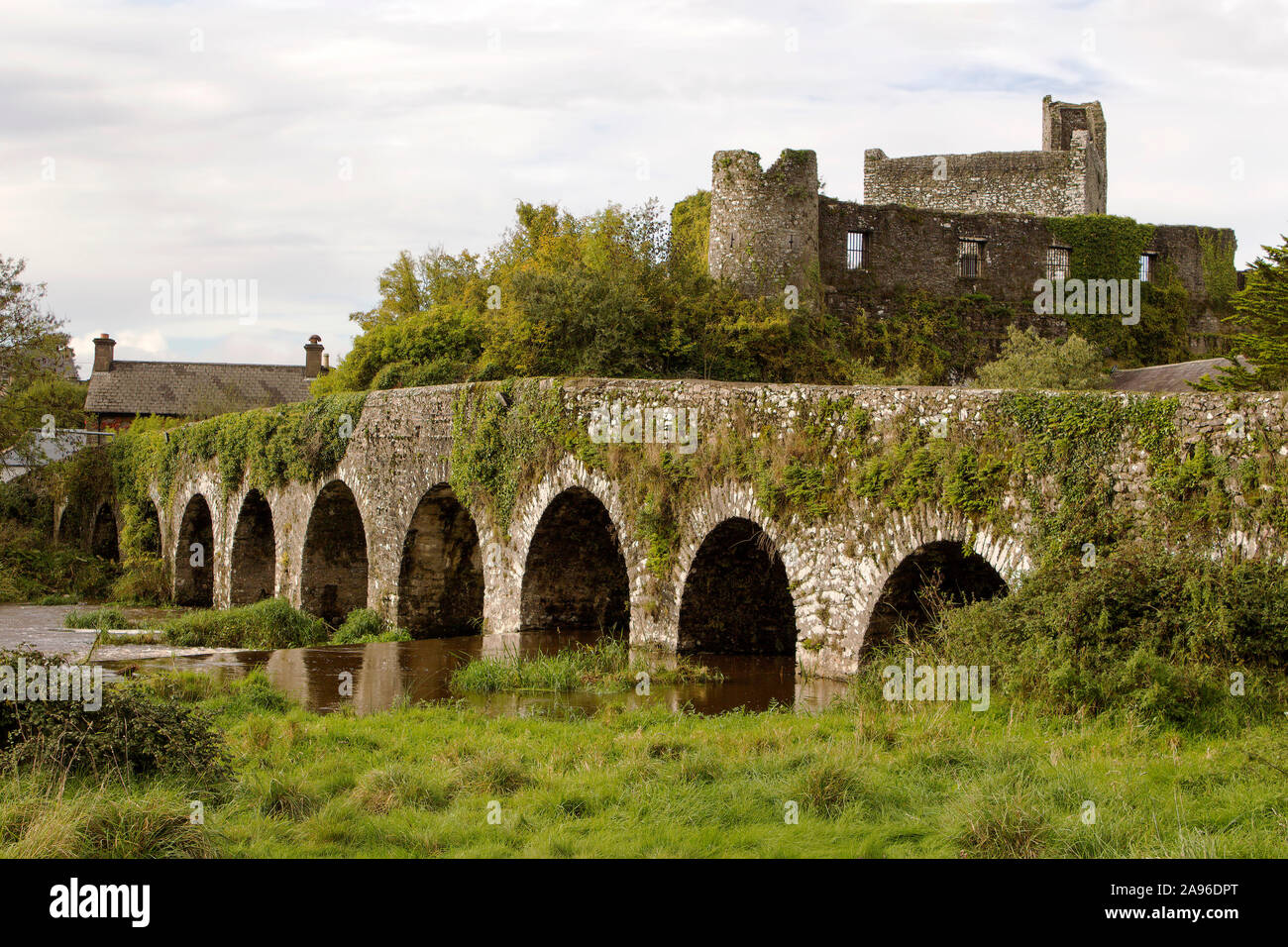Old stone bridge over Fusion River with Glanworth Castle behind.County ...