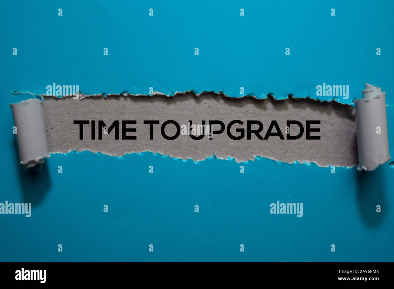Time To Upgrade Text written in torn paper Stock Photo - Alamy