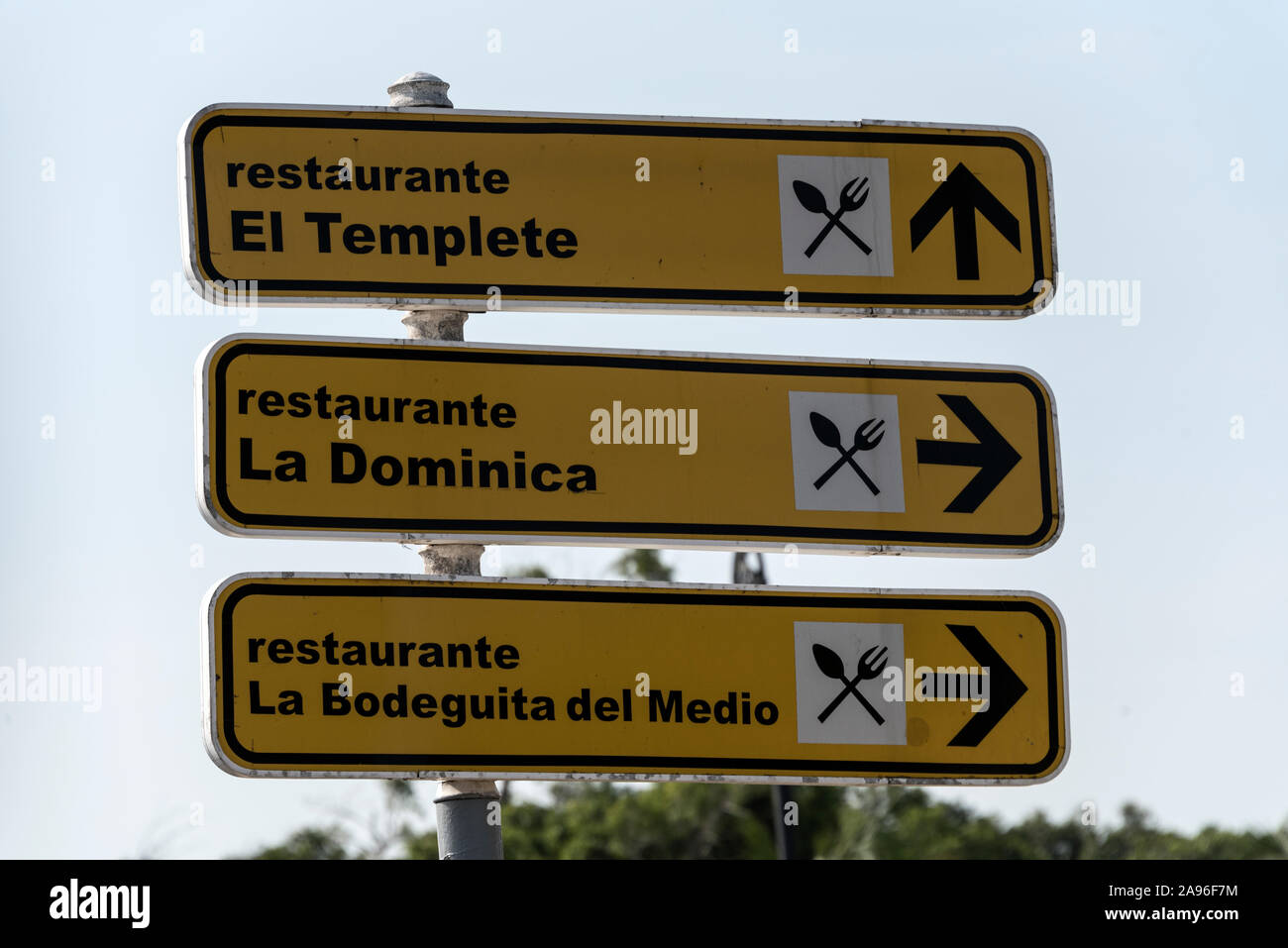 A road direction sign indicating the locations of restaurants in Havana ...