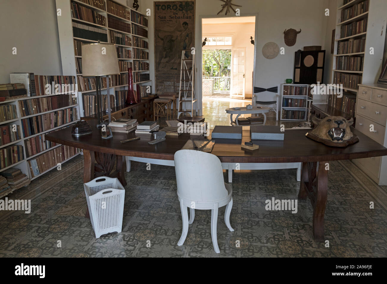 The library and a desk at the American author, Ernest Hemingway’s home ...