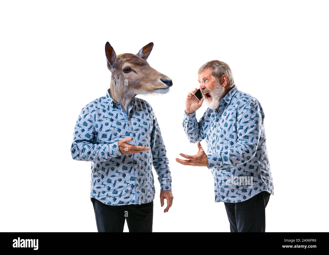 Portrait of senior man arguing with himself as a deer on white studio ...