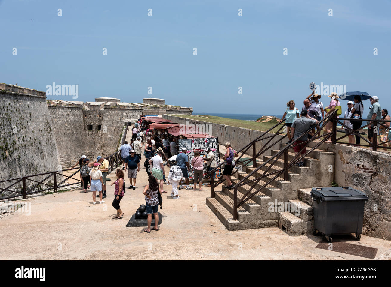 Parties of tourists visiting the historical Castillo De Los Tres Reyes ...