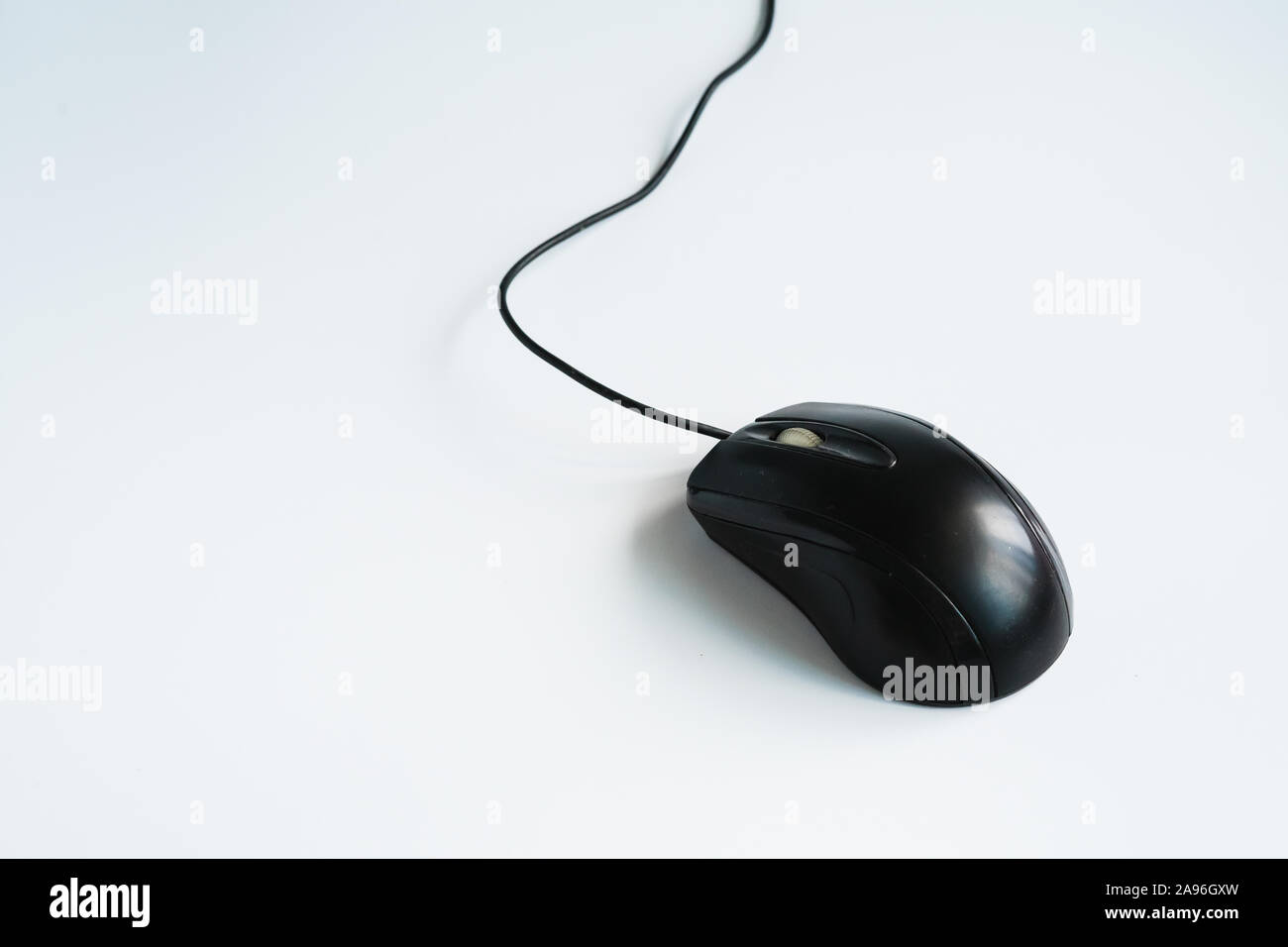 Modern black computer mouse on white background Stock Photo - Alamy