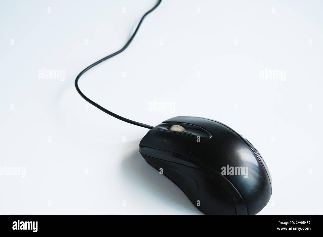 Modern black computer mouse on white background Stock Photo - Alamy