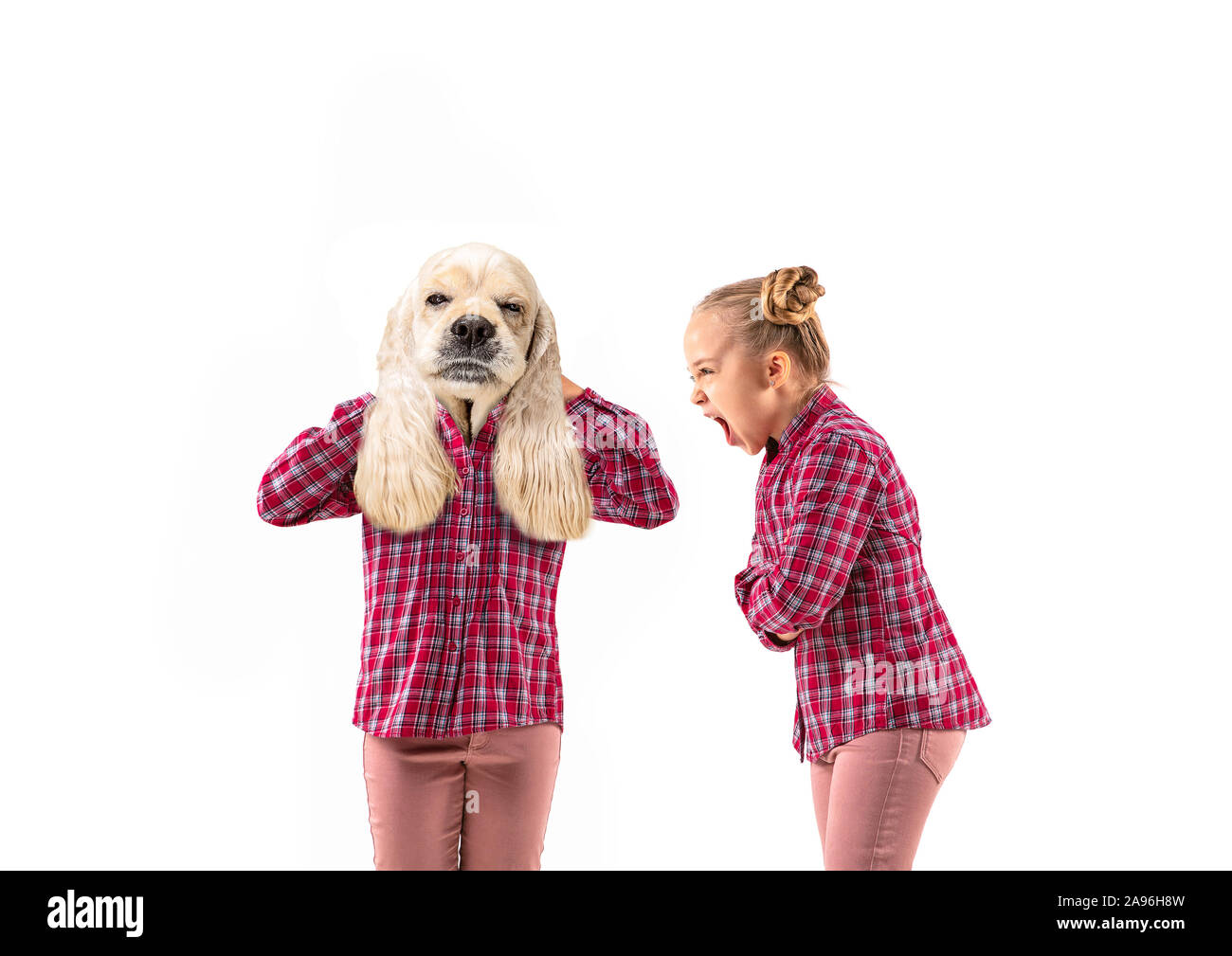 Young handsome girl arguing with herself as a dog on white studio ...