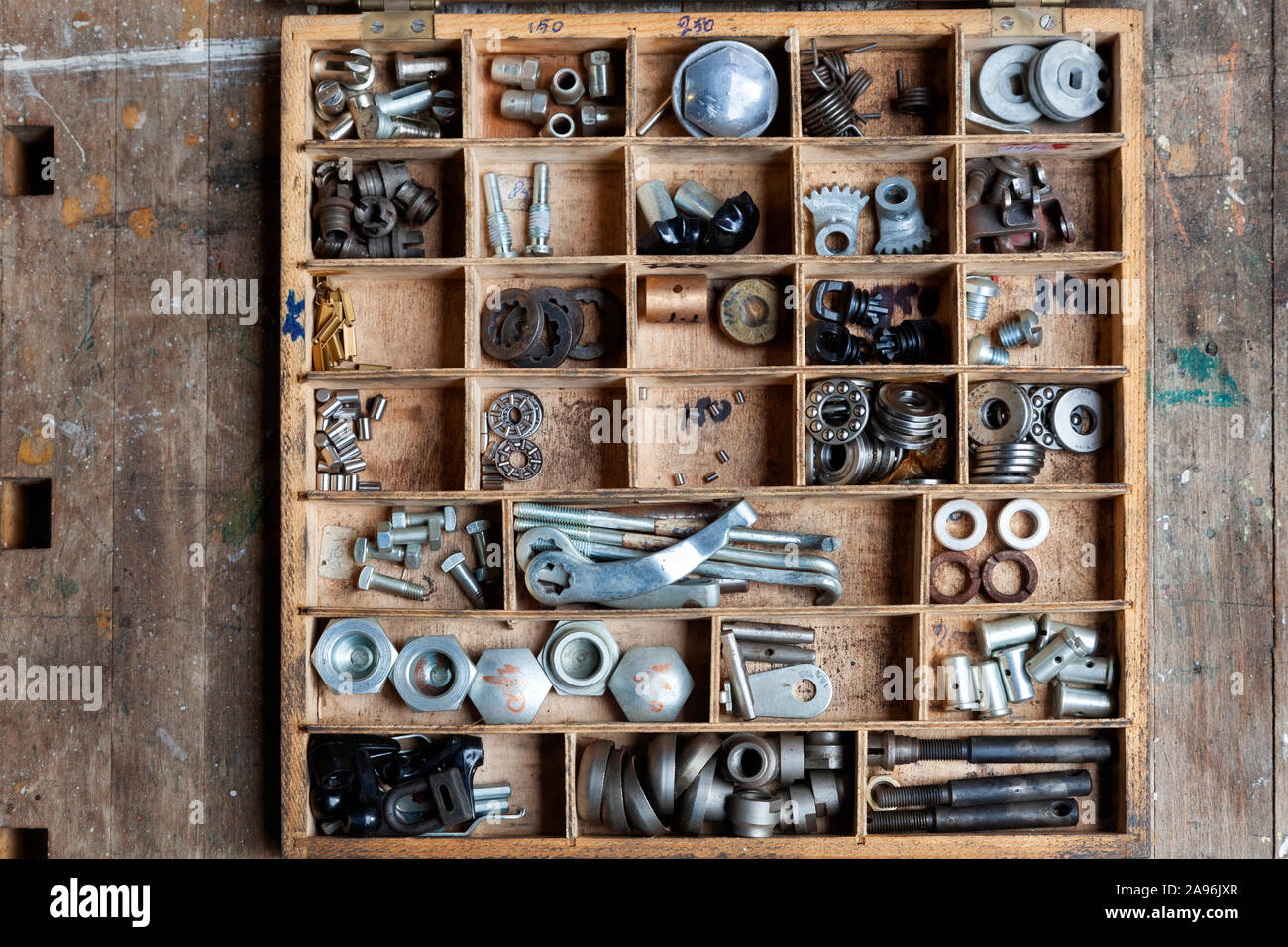 Old wooden box with an assortment of hardware for industrial use Stock ...