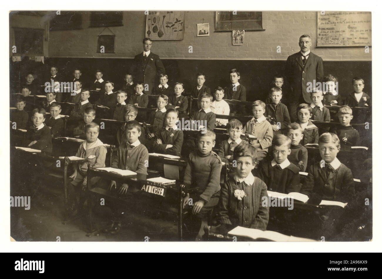 Early 1900's school boys sitting in classroom, circa 1910, studio of J ...