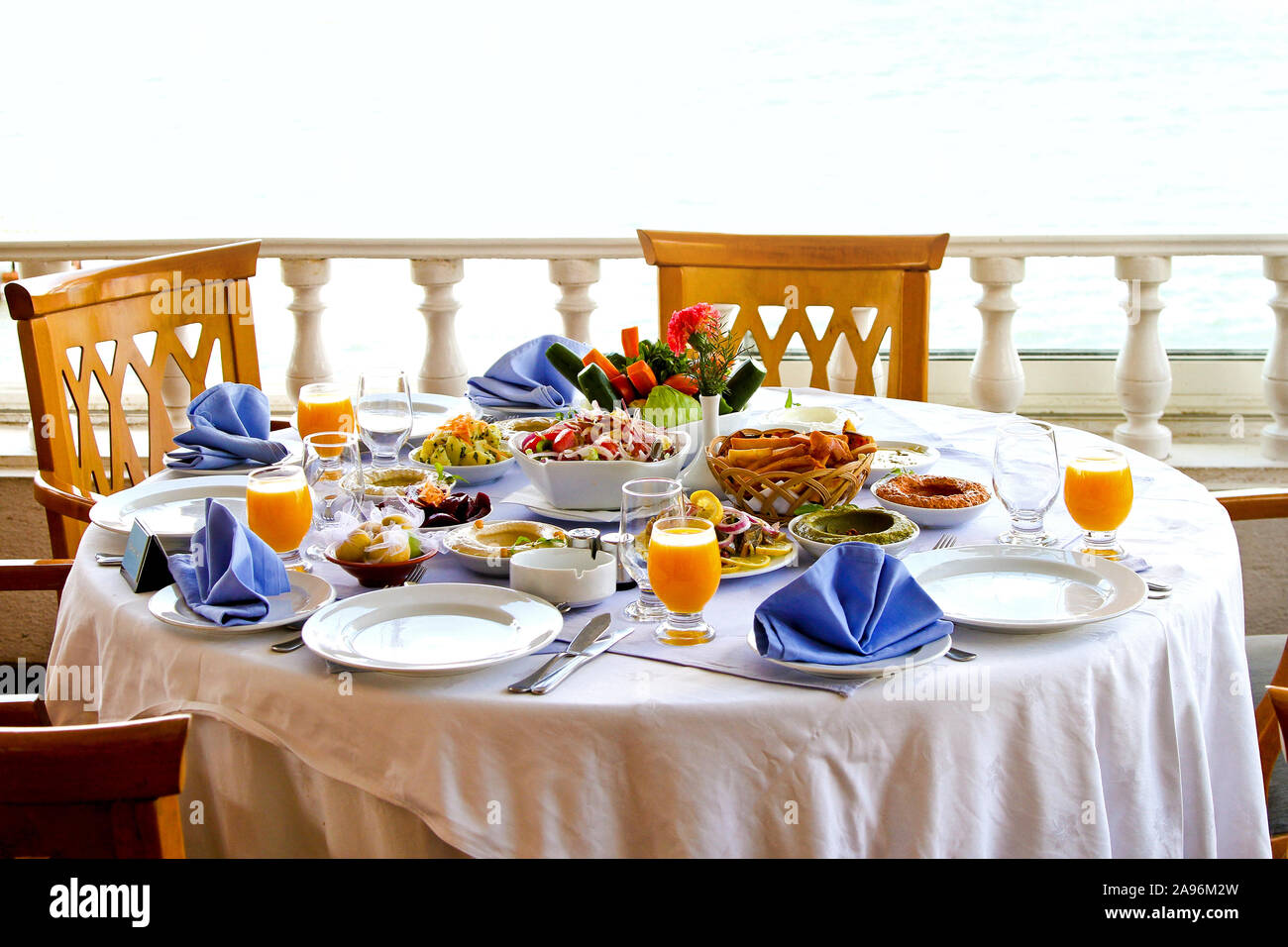 Elegant set up table with tasty food Stock Photo - Alamy
