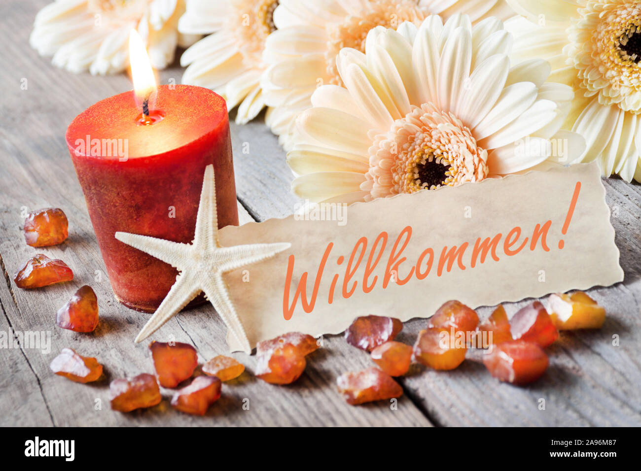 German welcome label and decoration with amber Stock Photo - Alamy