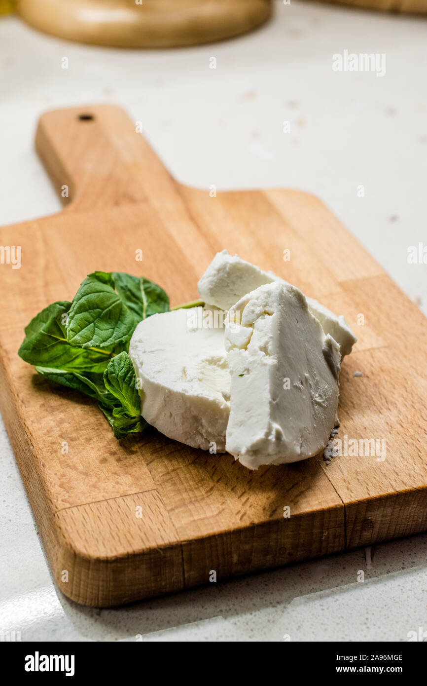 Goat Cheese Slices on Wooden Board. Ready to Eat. Organic Food Stock ...