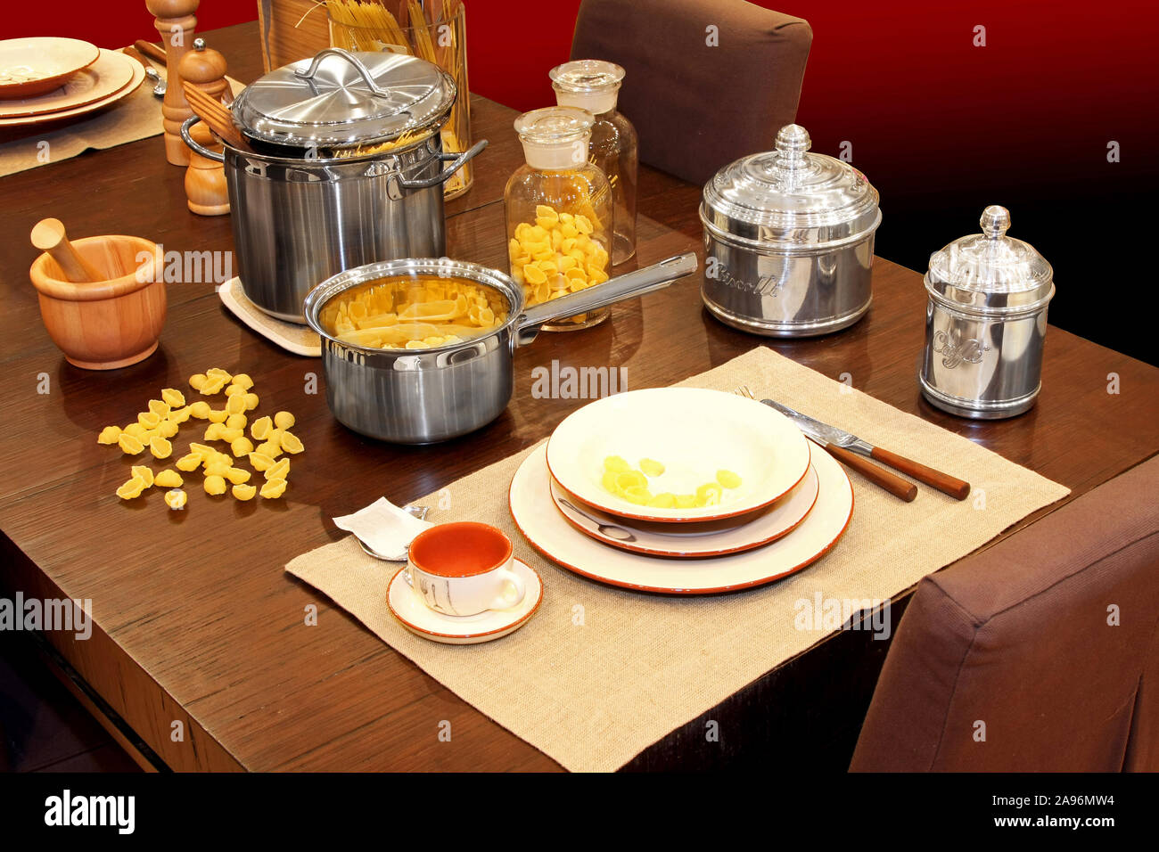 Brown wood table with Italian pasta meal Stock Photo - Alamy