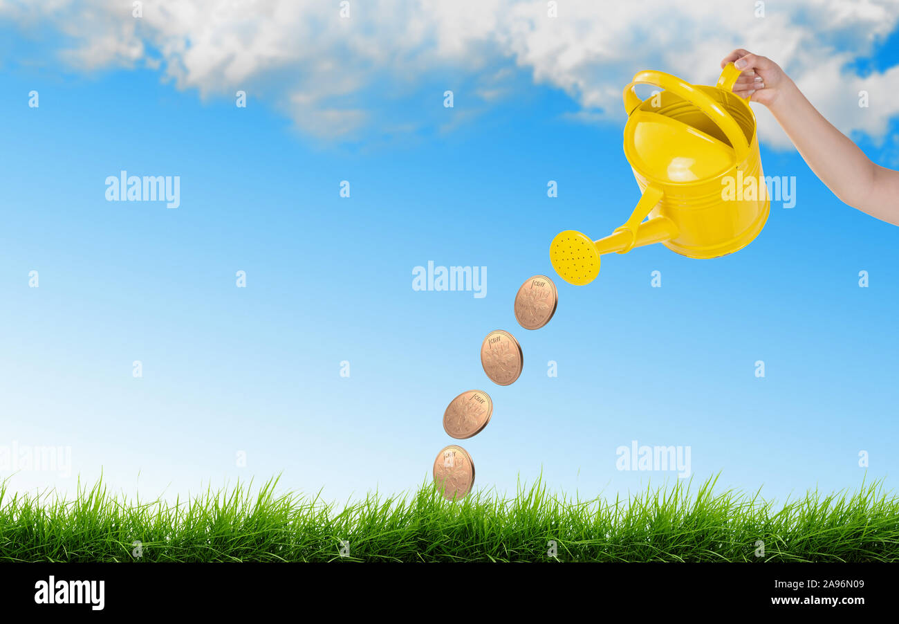 Canadian One Cents are coming out from a yellow watering can holding by ...