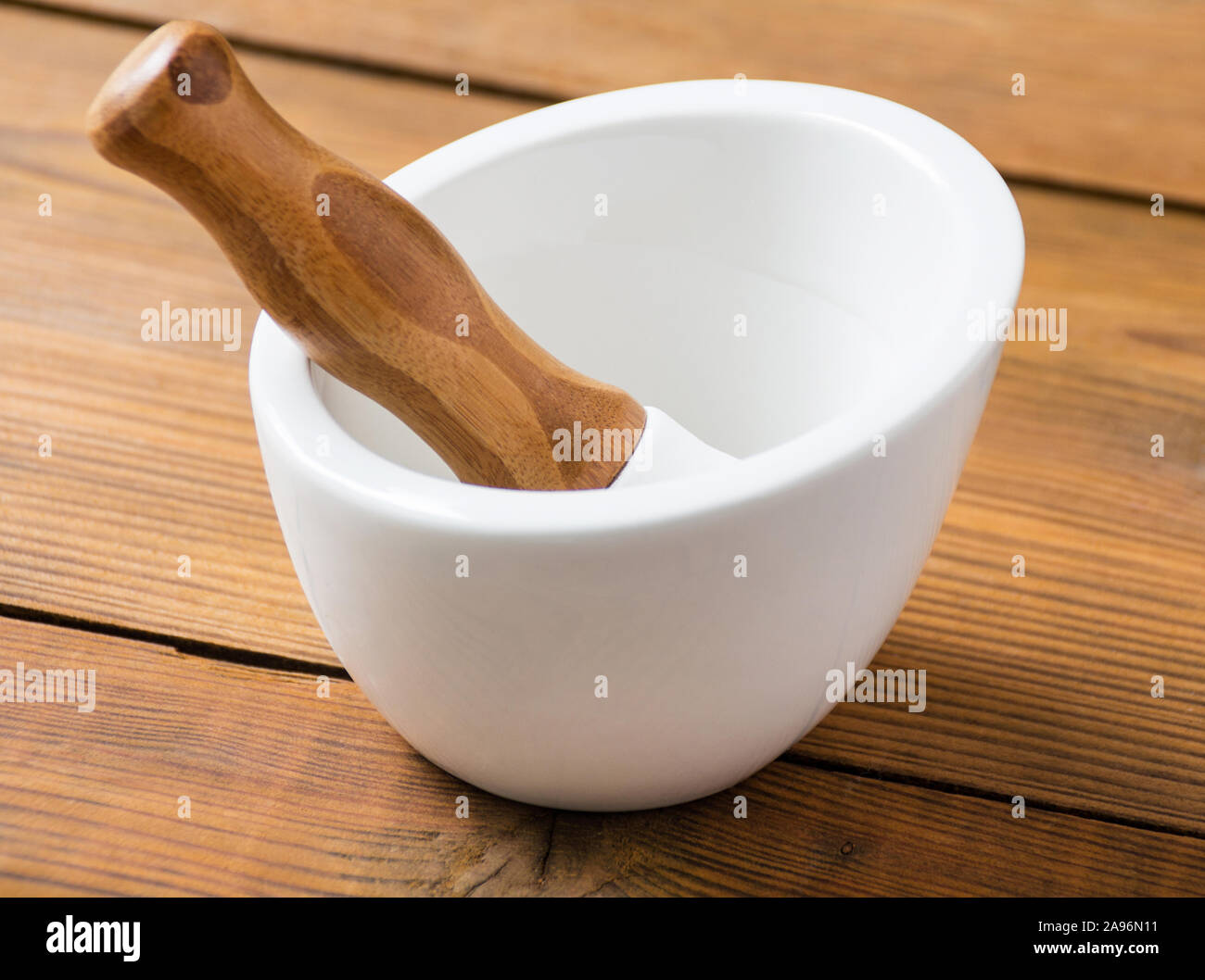 Mortar and wooden tabke Stock Photo - Alamy