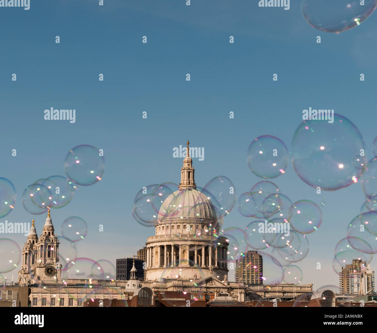 Bubbles blown by buskers on the south Bank float across the river ...