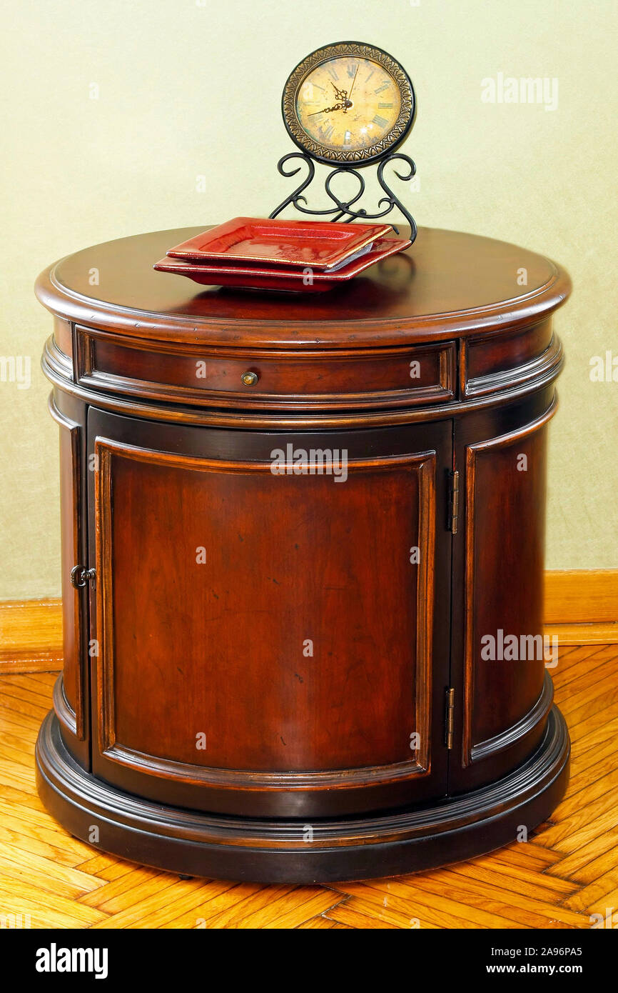Close up shot of round night table cabinet Stock Photo - Alamy