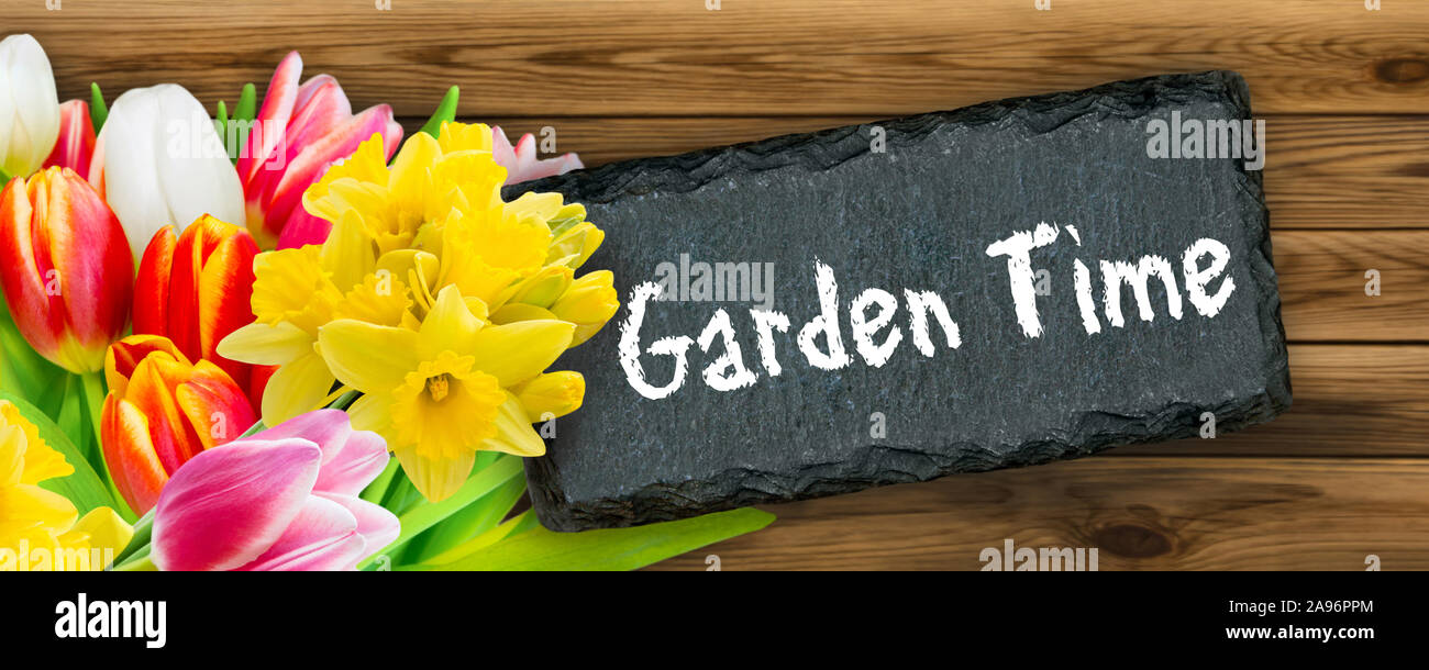 Tulips and Label Garden Time Stock Photo - Alamy