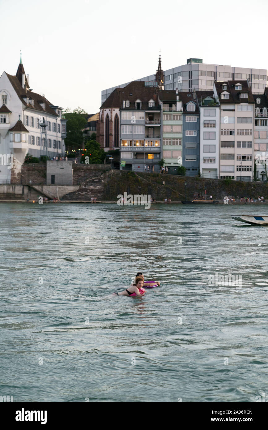 People floating in Rhine river in Basel Stock Photo - Alamy