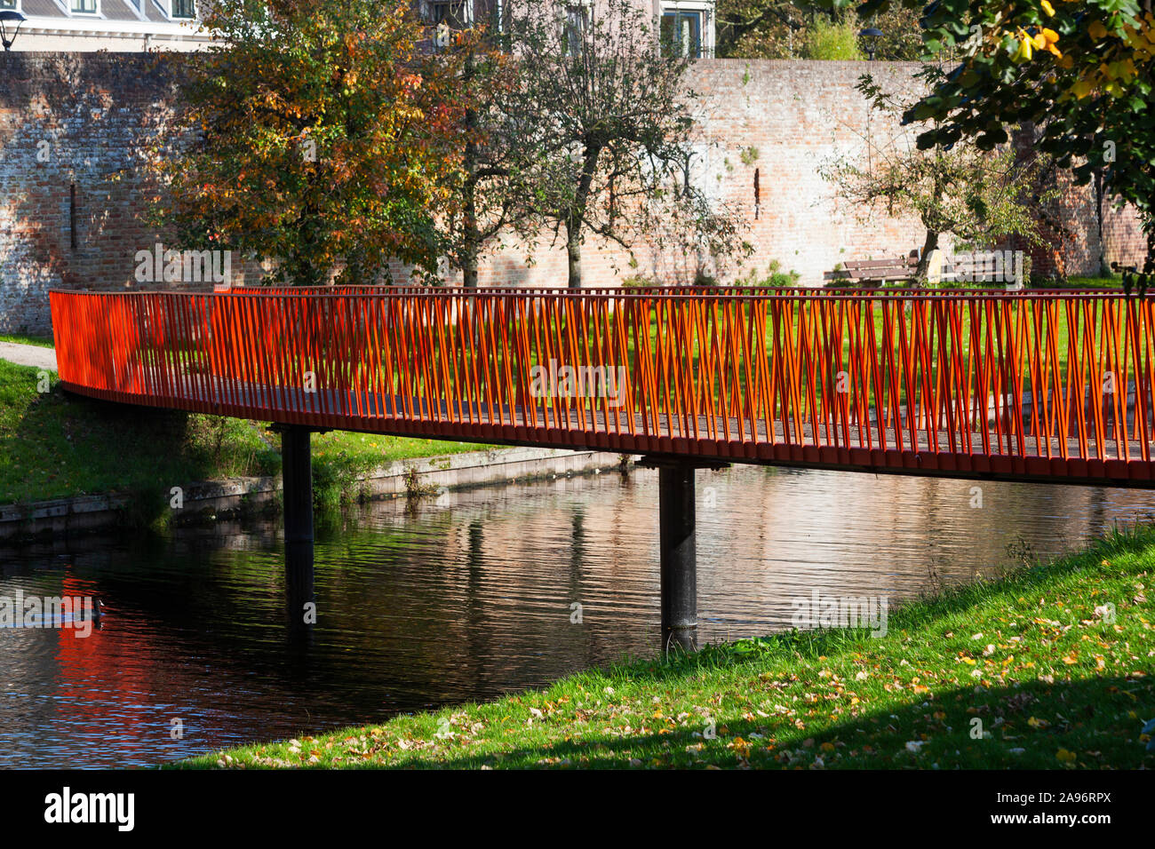 Red metal bridge connection to the old city wall in Vianen in the ...