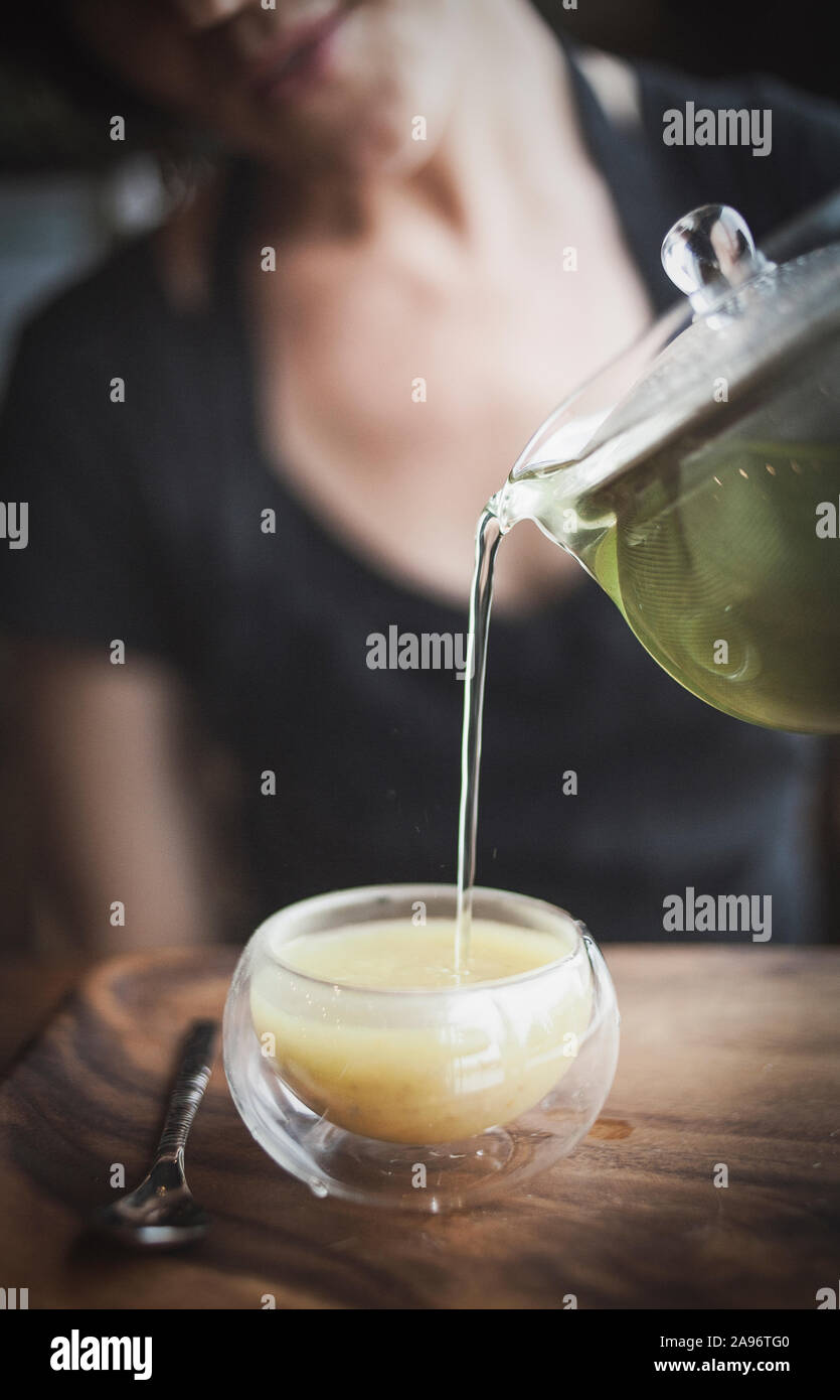 Woman pouring water glass hi-res stock photography and images - Alamy