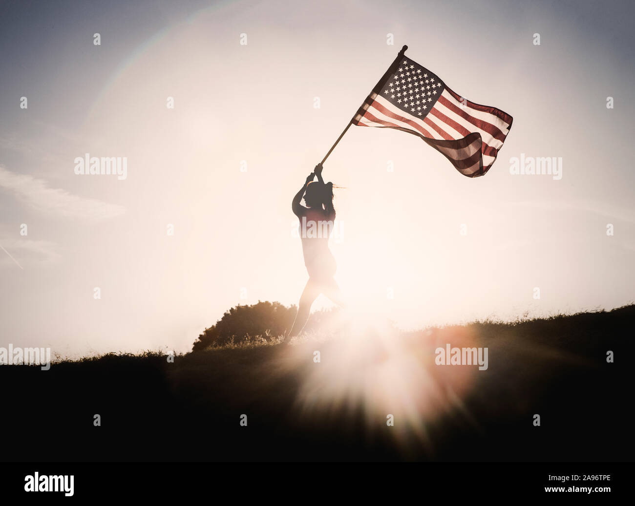 Woman Running with American Flag Stock Photo - Alamy