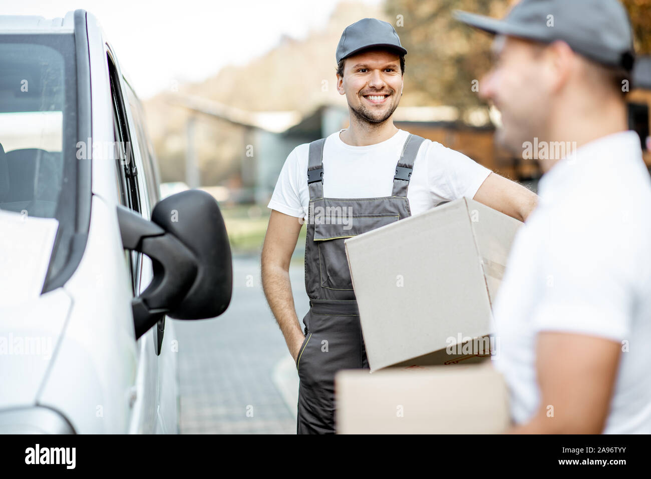 Man Unloading Boxes High Resolution Stock Photography and Images - Alamy