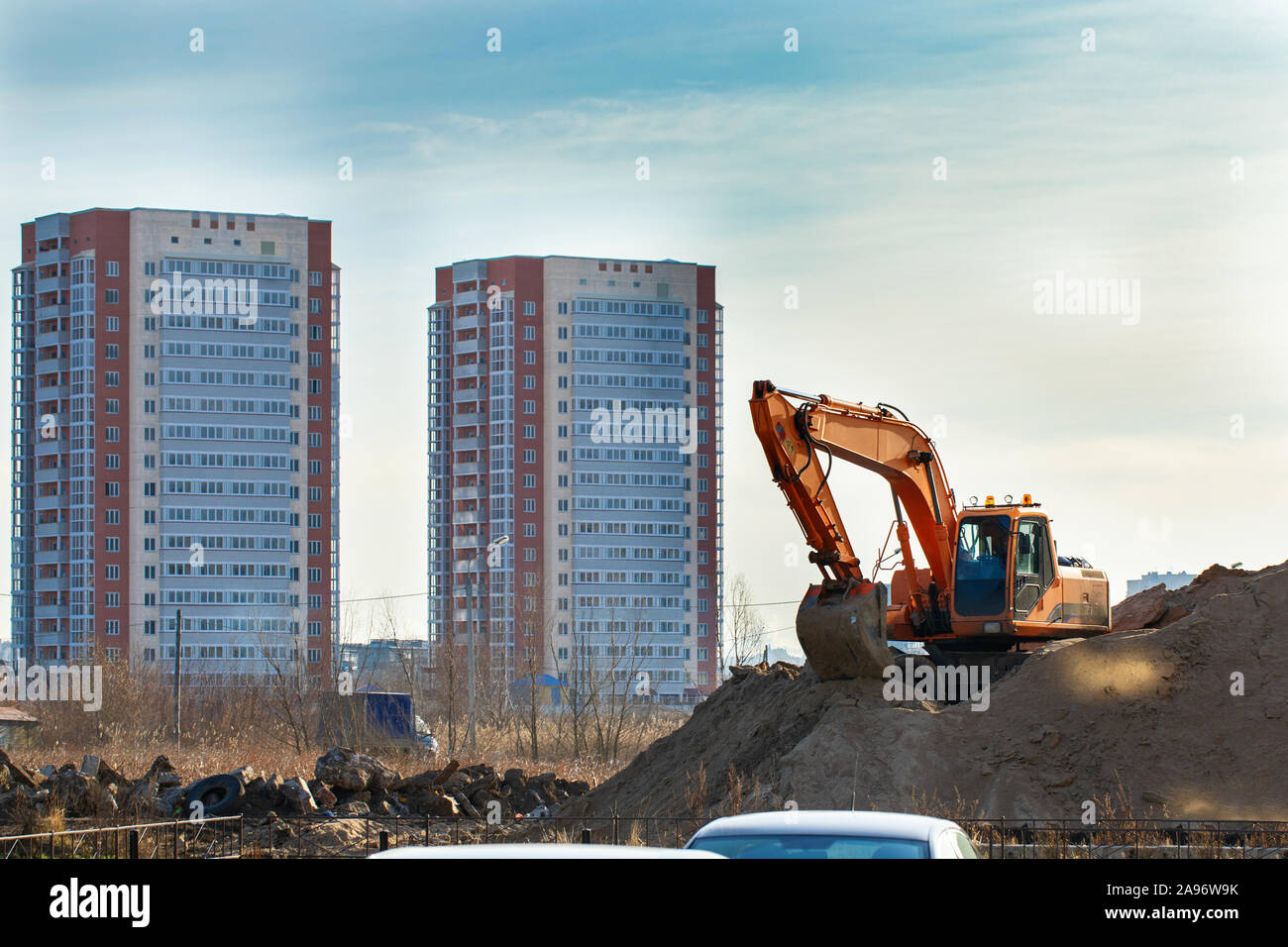 Excavator used for pipe laying works and house foundation. Digging a ...