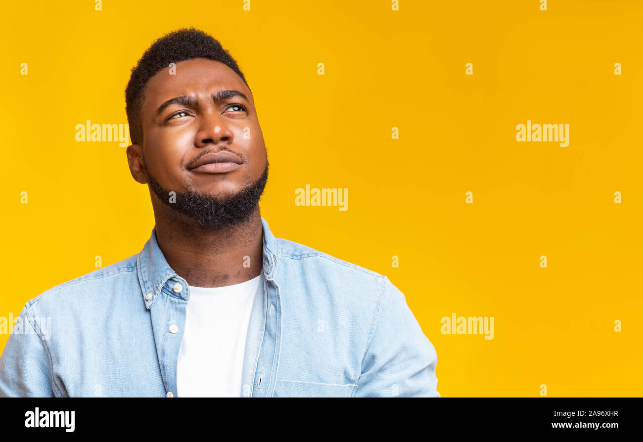 Man with suspicious look yellow hi-res stock photography and images - Alamy