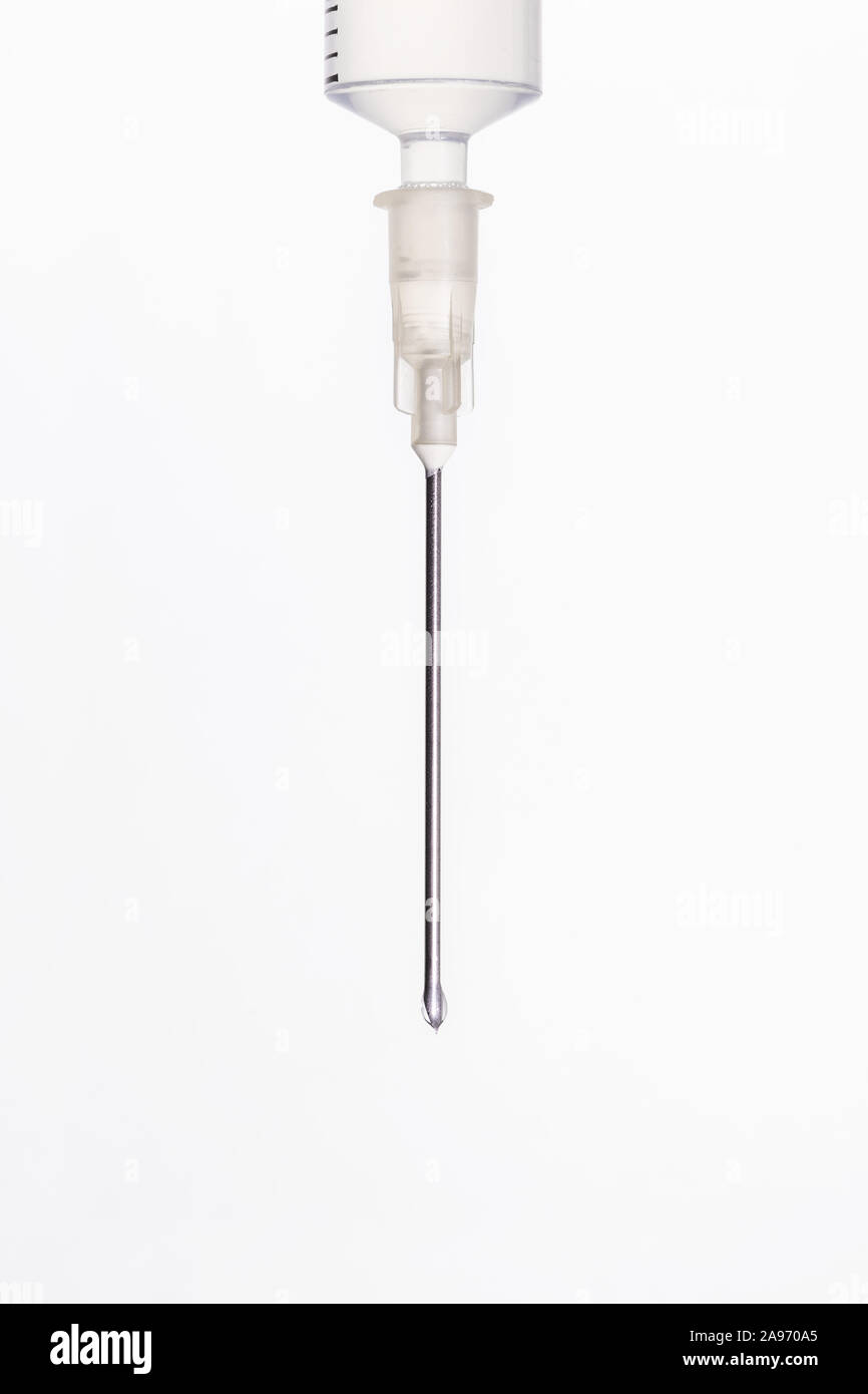 Closeup of medical hypodermic syringe needle isolated on white ...