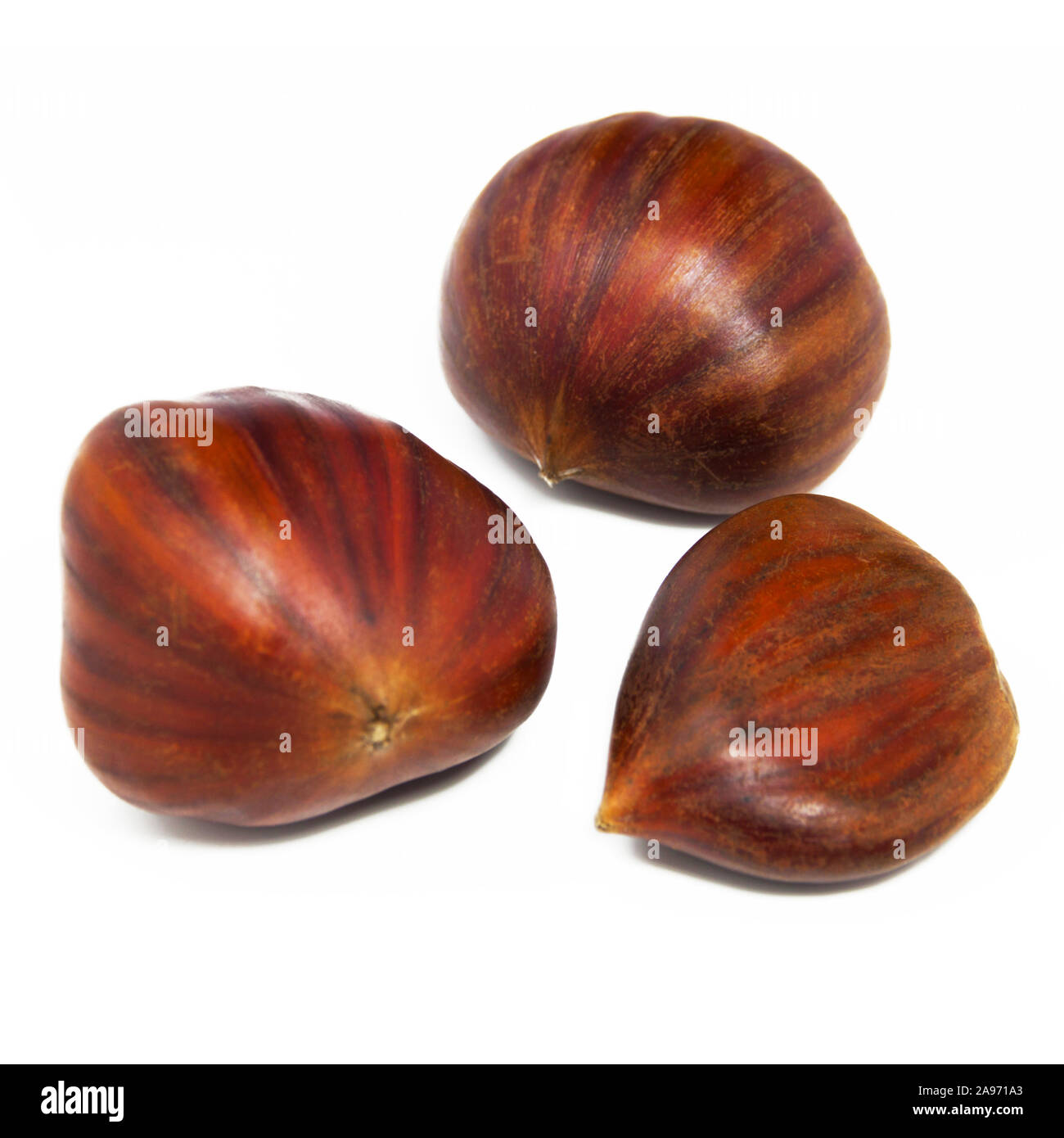 Sweet chestnuts on white background Stock Photo - Alamy