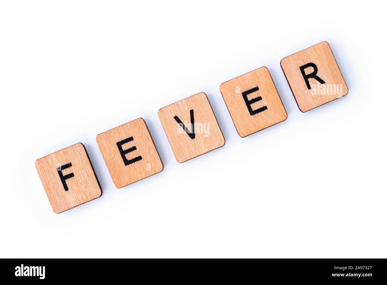 The word FEVER, spelt with wooden letter tiles over a white background ...