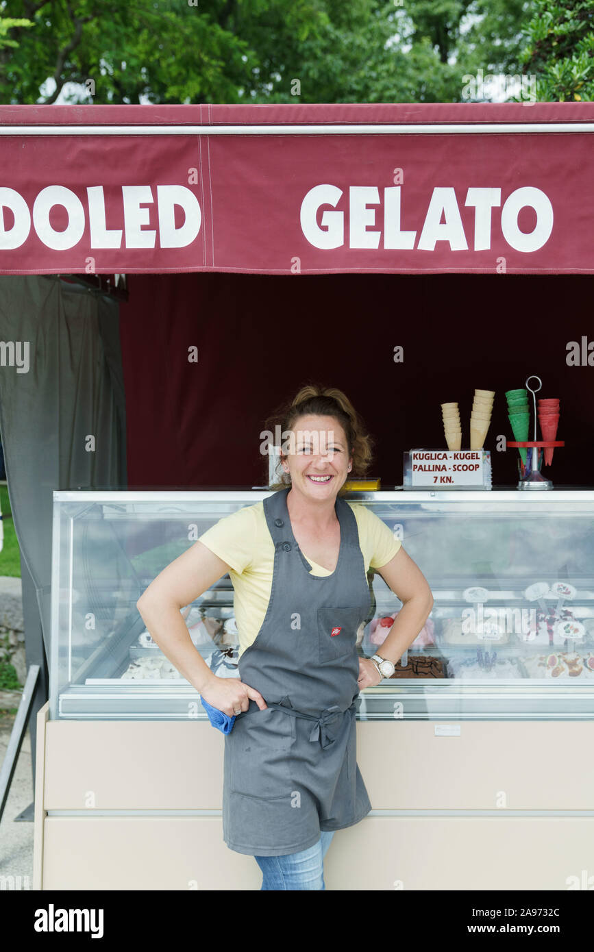 Ice-cream stand with lady selling the ice-cream Stock Photo - Alamy