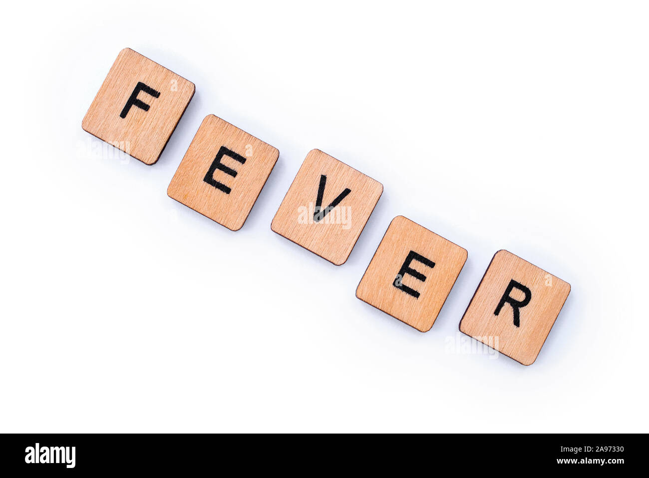The word FEVER, spelt with wooden letter tiles over a white background ...
