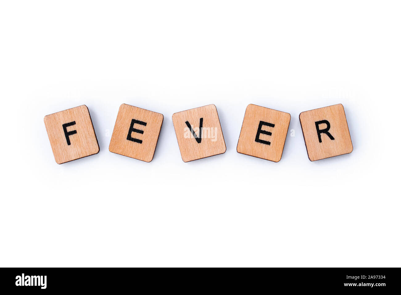The word FEVER, spelt with wooden letter tiles over a white background ...